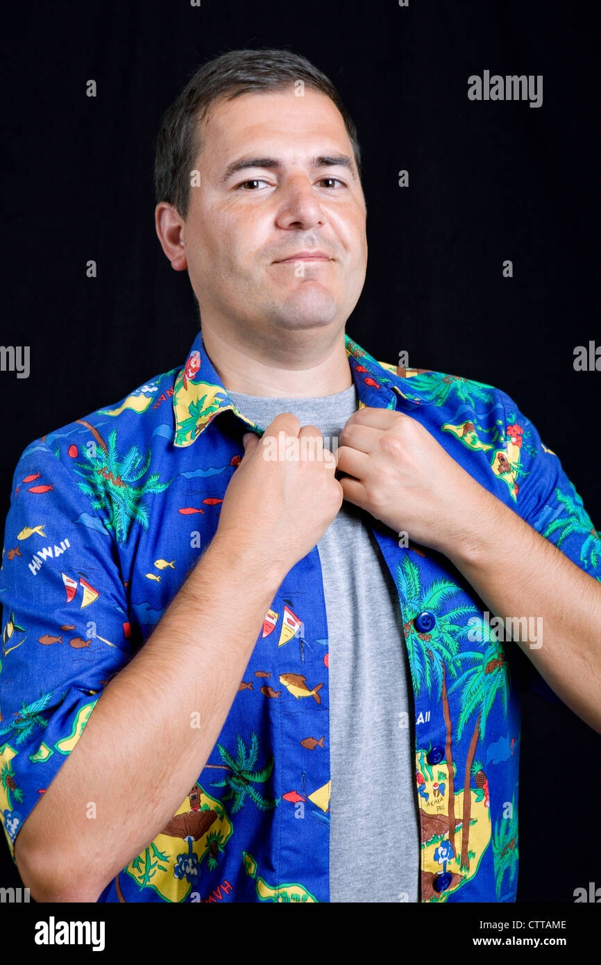 young happy man with a hawaiian shirt on black background Stock Photo ...