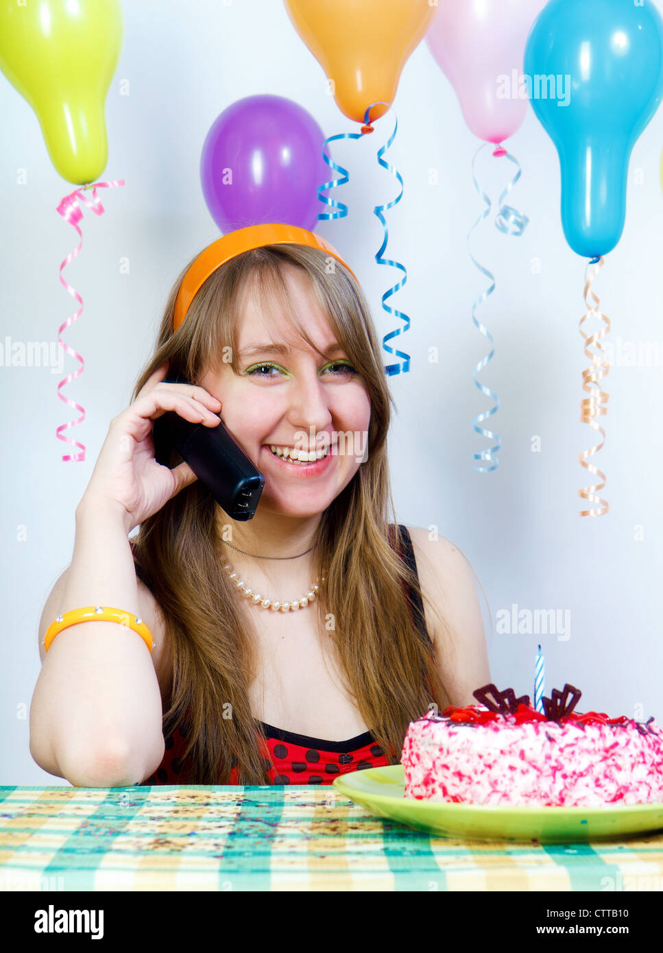 Birthday. Happy attractive girl talking on the phone Stock Photo - Alamy