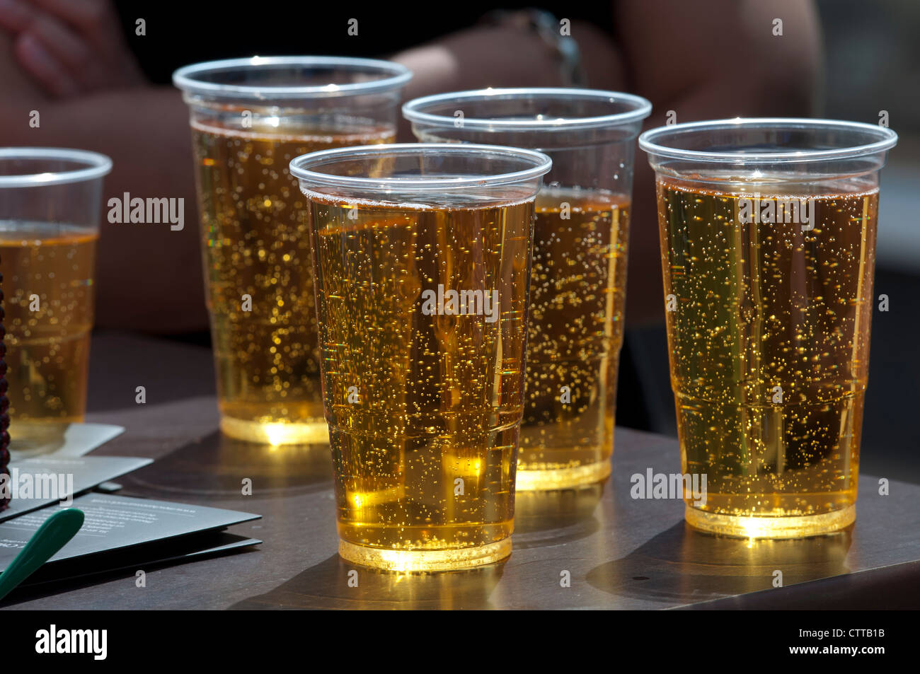 Plastic glasses of cider Stock Photo - Alamy
