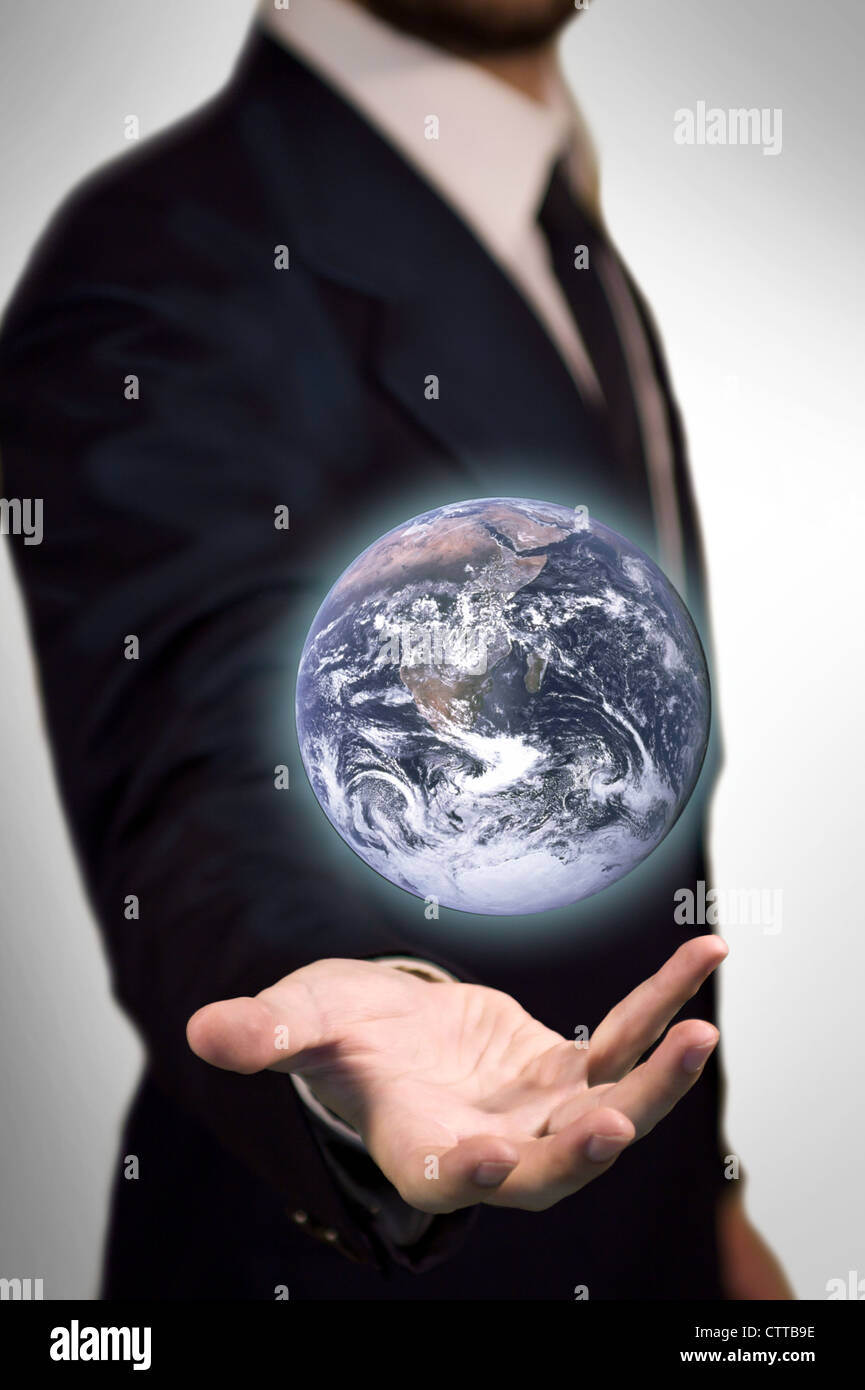 Earth Sphere in the palm of a business man like a magic sphere Stock ...