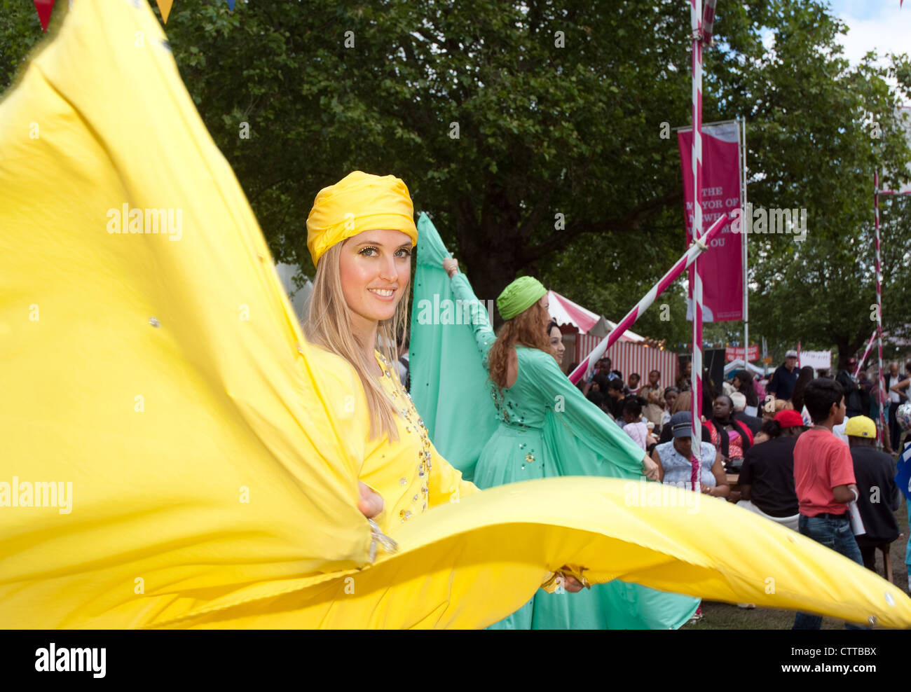 a group of dancers wearing brightly colored costumes Stock Photo - Alamy