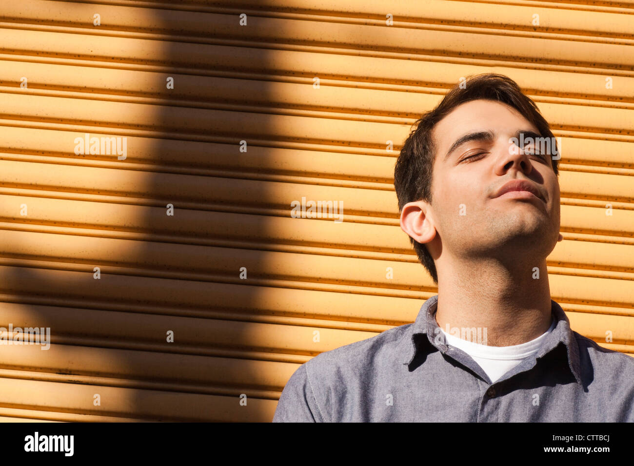 Handsome young man daydreaming Stock Photo - Alamy