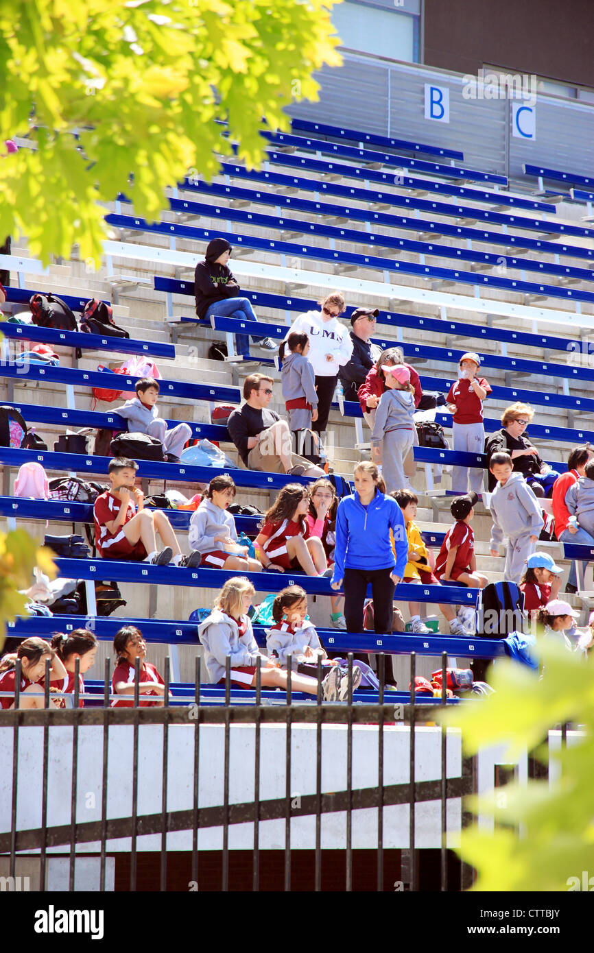 People seating on stadium stalls Stock Photo - Alamy