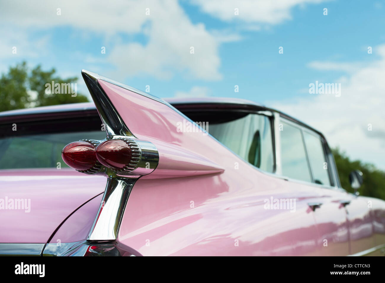 1959 Pink Cadillac. Sharp tail fin with dual bullet tail lights Stock ...
