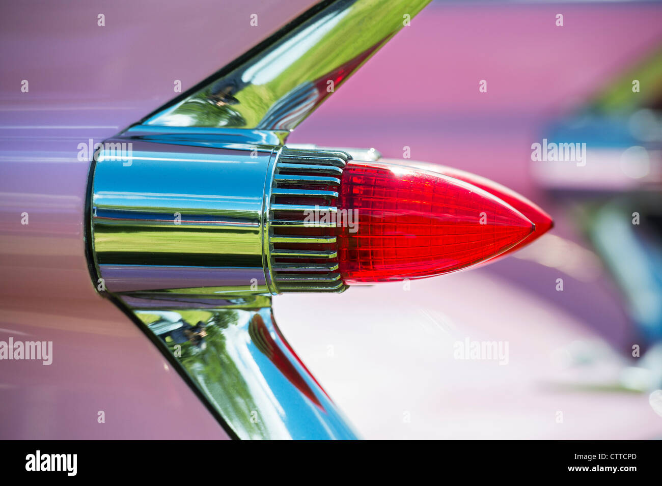 1959 Pink Cadillac. Sharp tail fin with dual bullet tail lights Stock ...