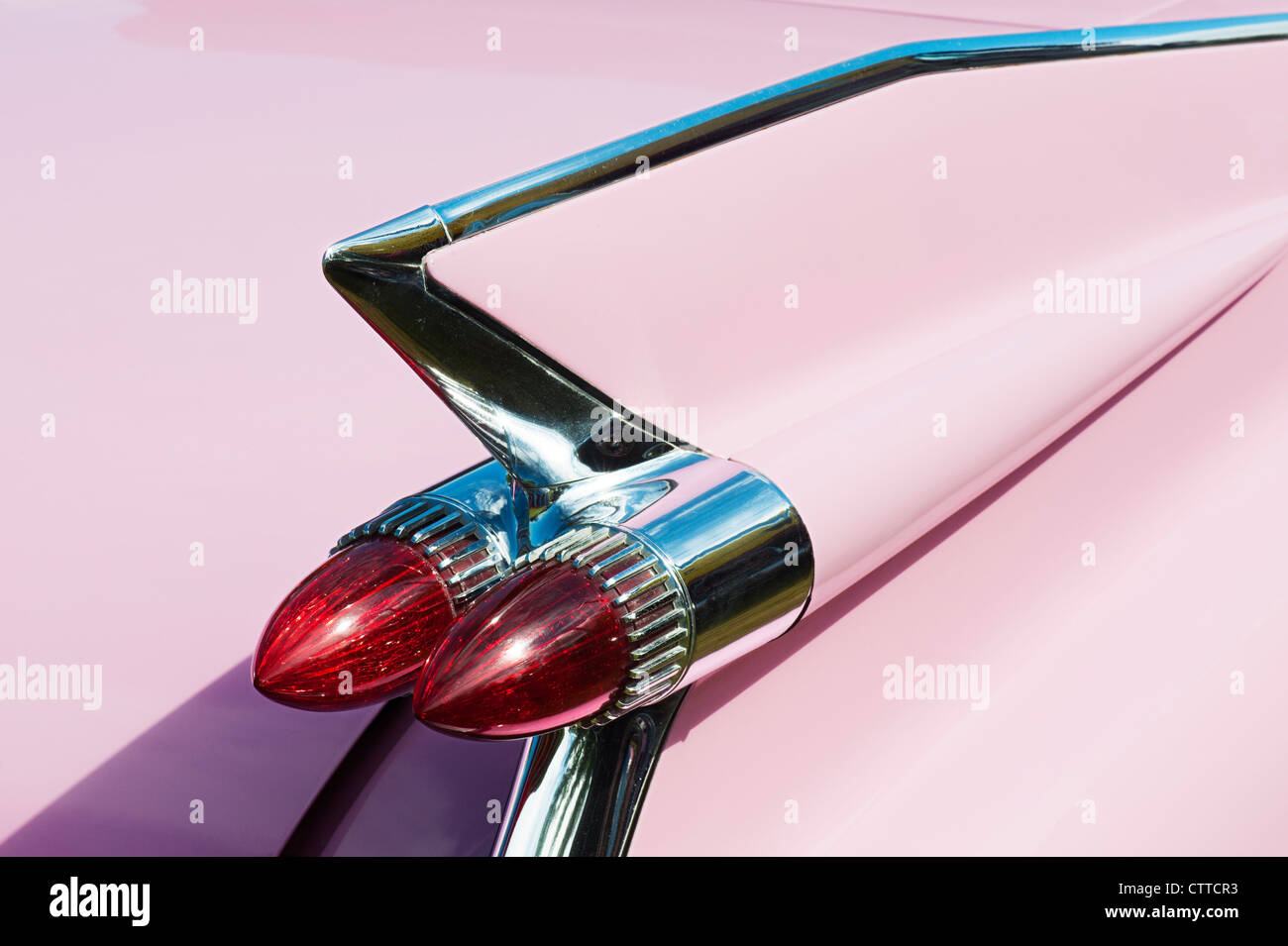 1959 Pink Cadillac. Sharp tail fin with dual bullet tail lights Stock ...