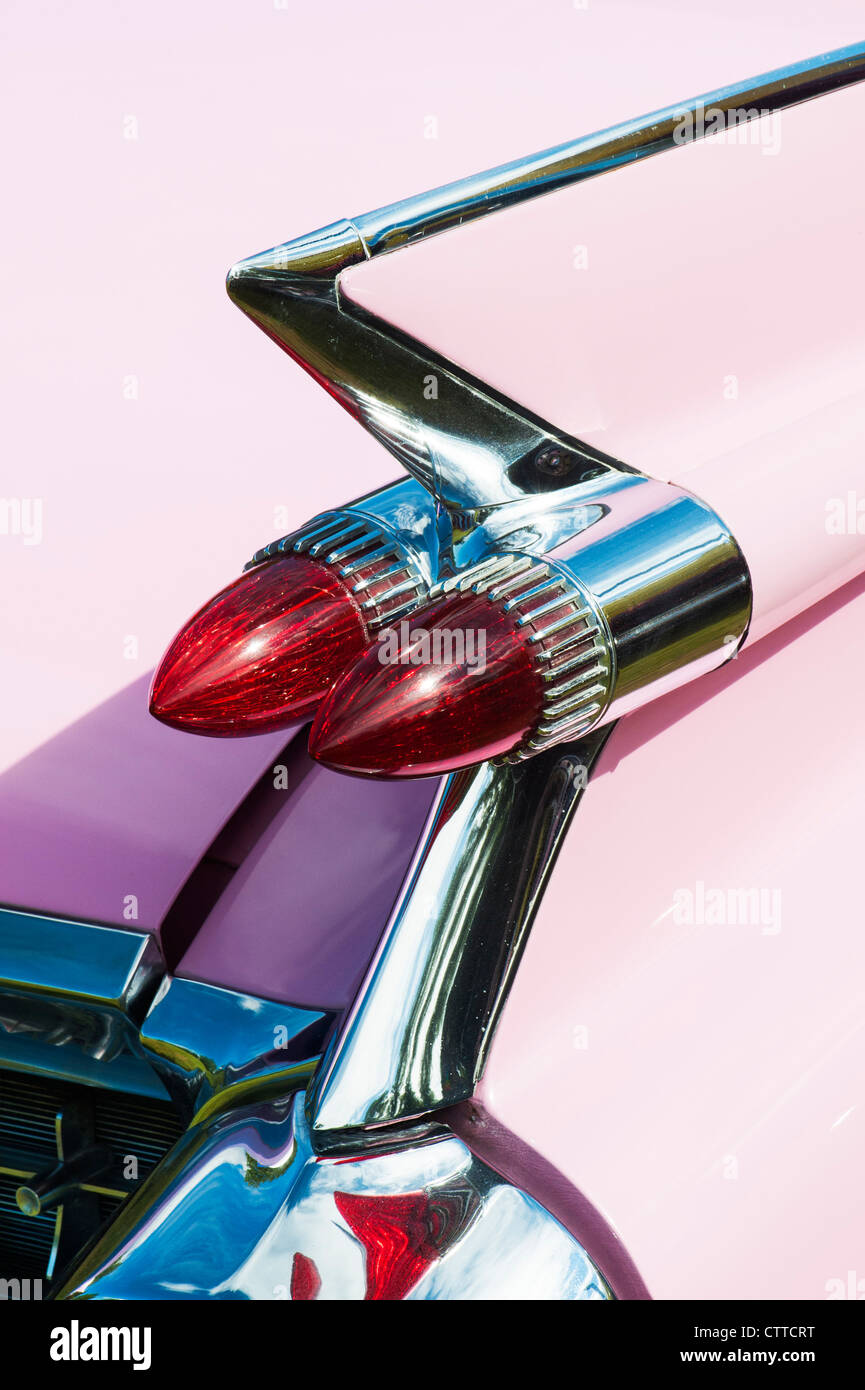 1959 Pink Cadillac. Sharp tail fin with dual bullet tail lights Stock ...