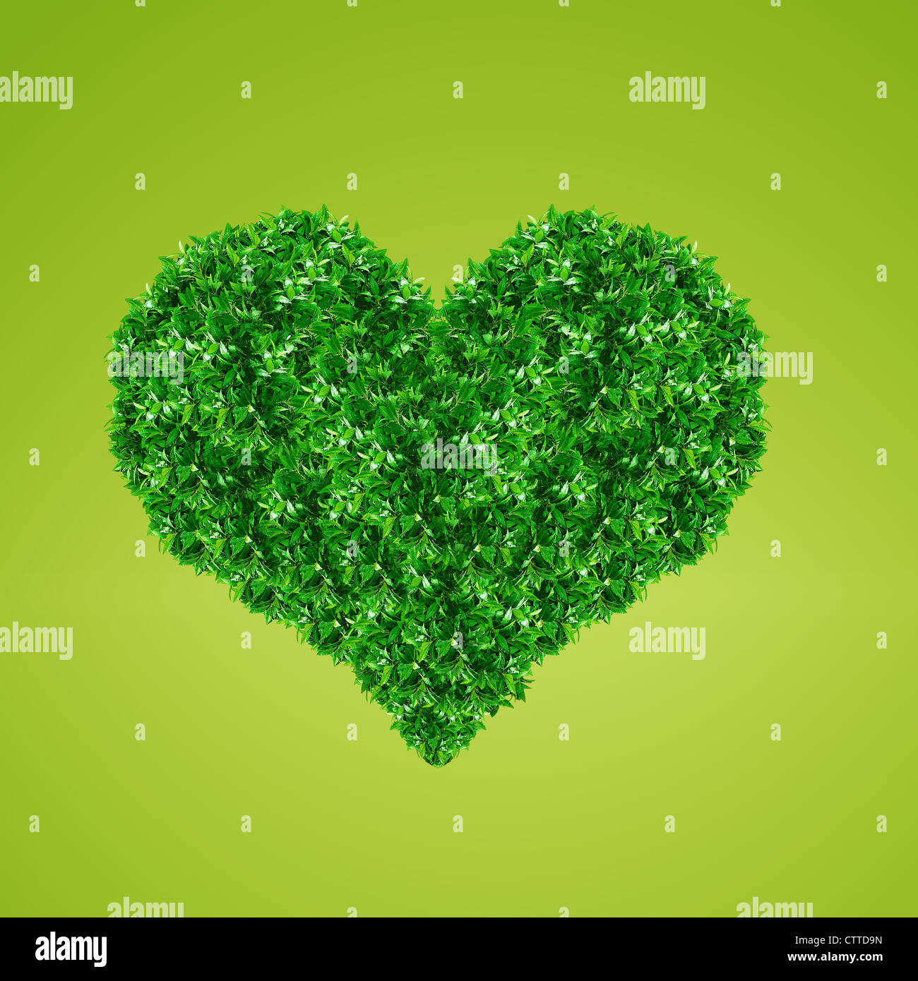 Green Heart Sign made from grass green background Stock Photo - Alamy