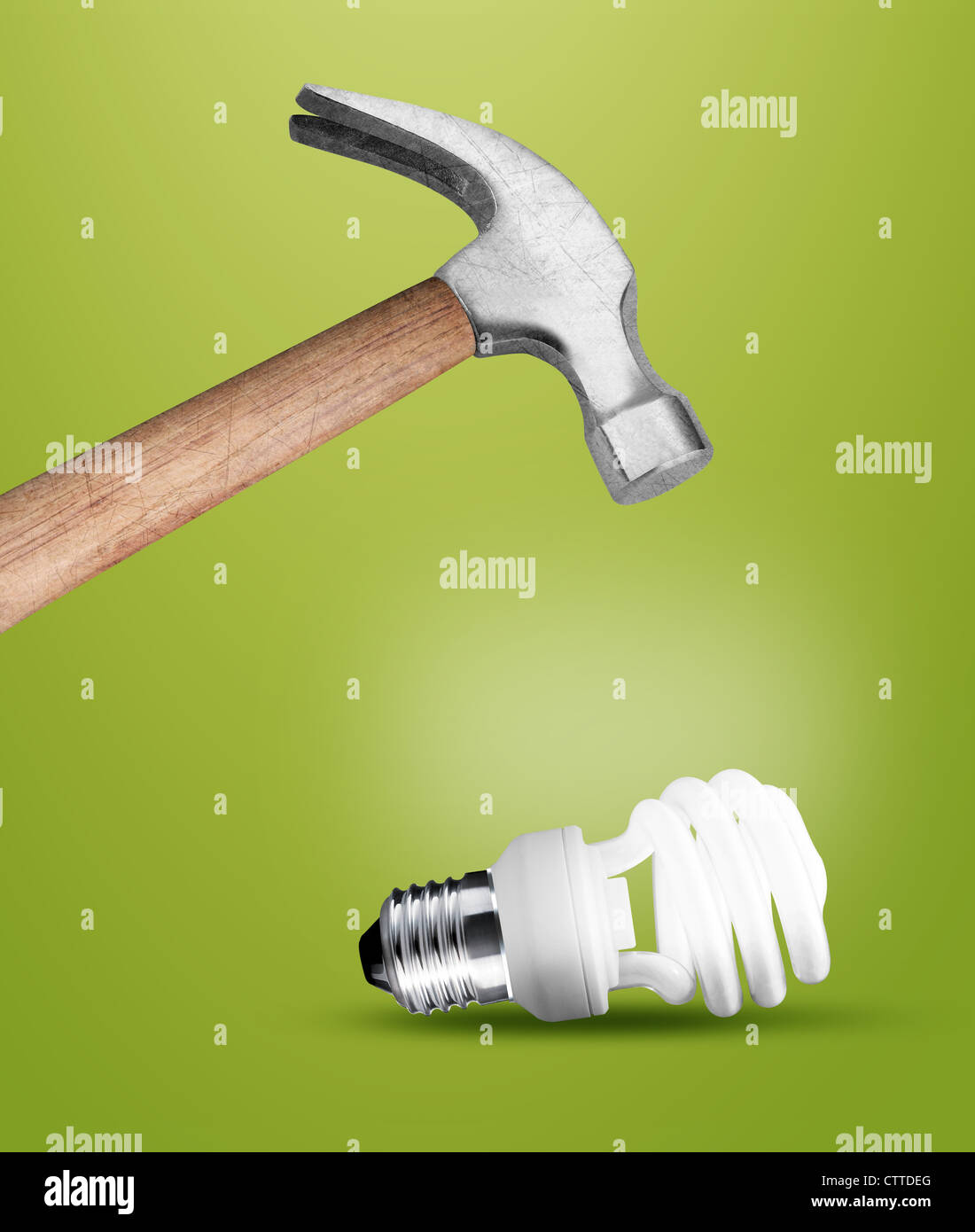 Hammer hitting a lightbulb Stock Photo - Alamy