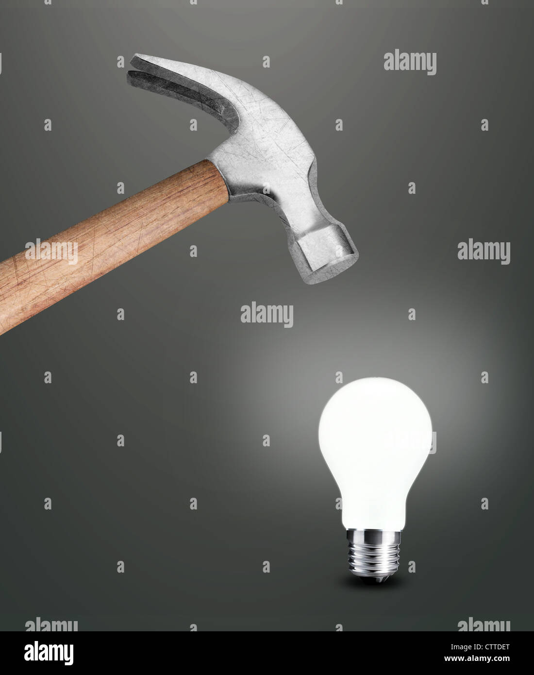 Hammer hitting a lightbulb Stock Photo - Alamy
