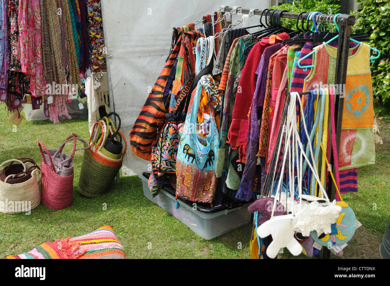 Colourful Fair Trade clothes bags and scarfs for sale at a country fair ...