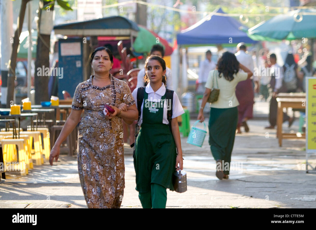 Hindu mother and daughter walk on the street in (Rangoon) Yangon ...