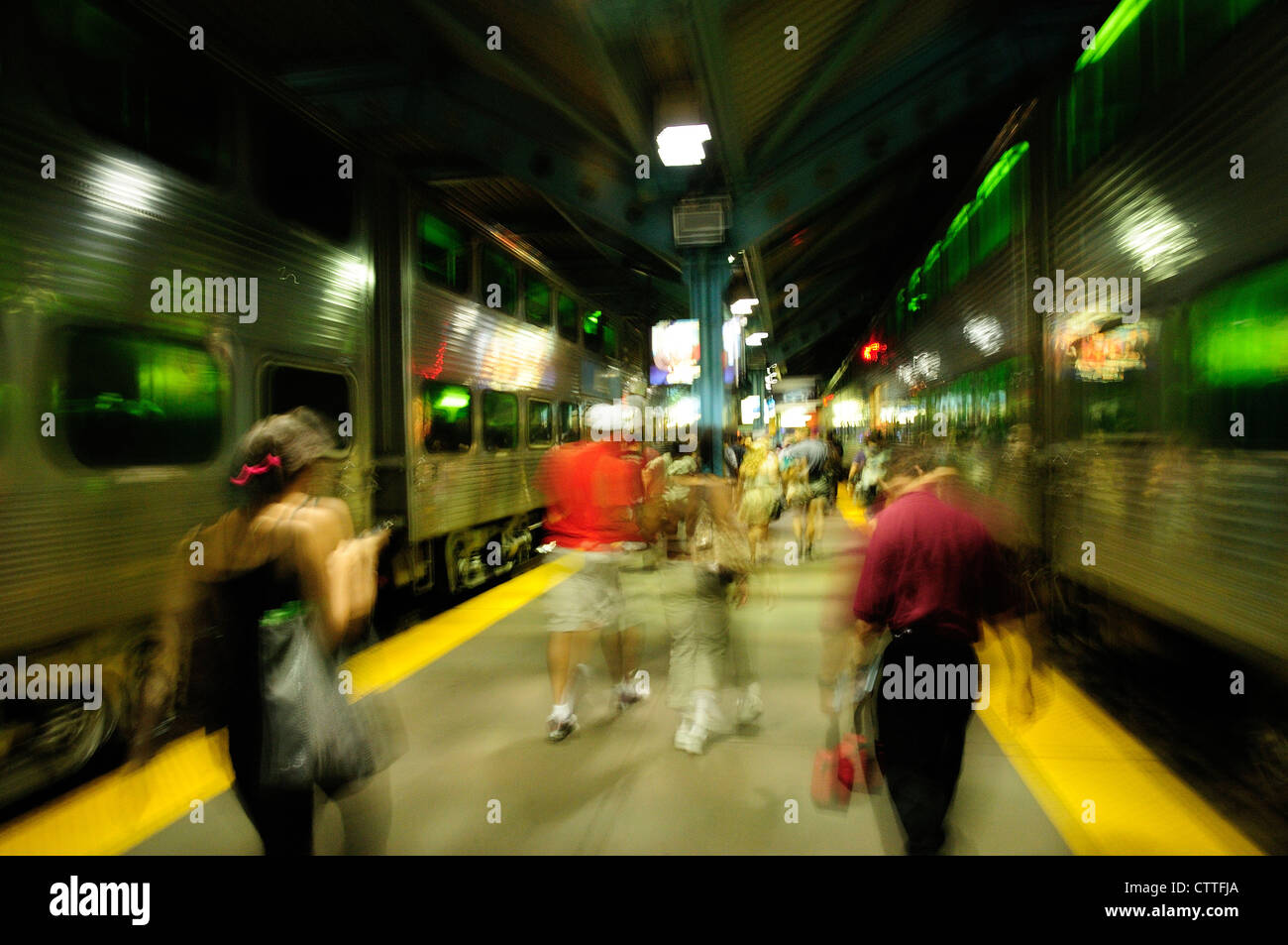 Train station platform with commuters and passengers moving on and off ...