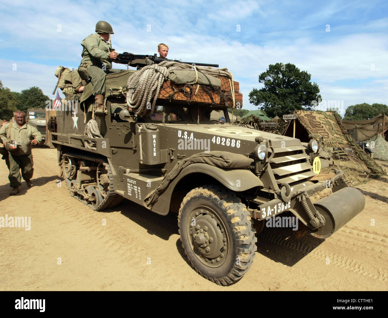 A white halftrack vehicle, often used by the U.S. military, is a ...