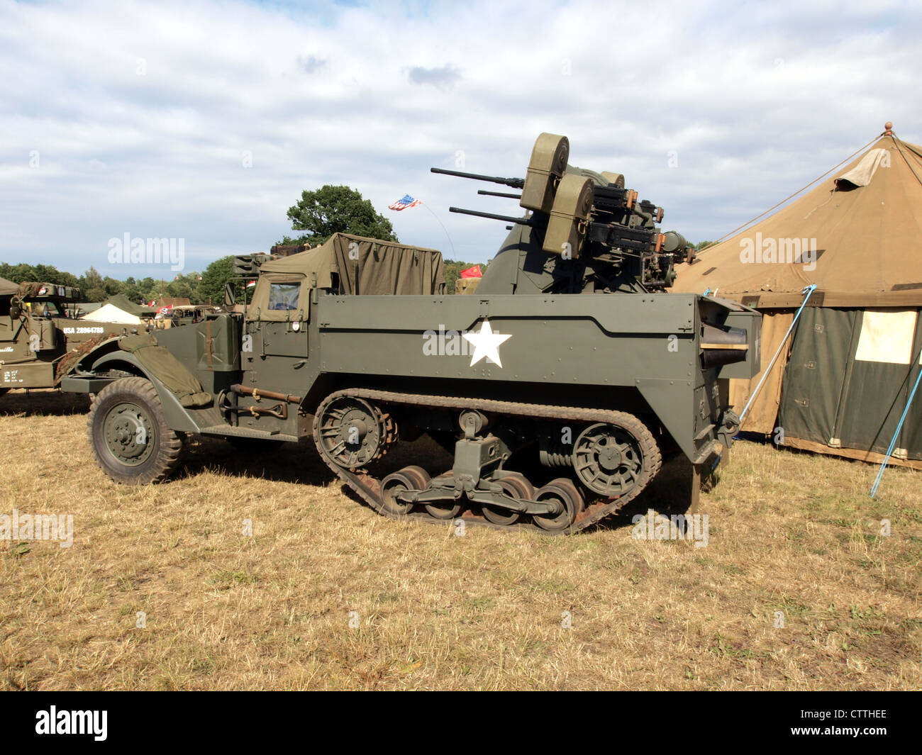 The white halftrack, used by the military, is equipped with armor and ...