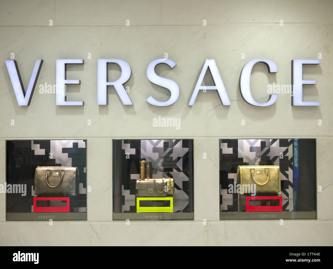 Versace handbags on display Stock Photo - Alamy