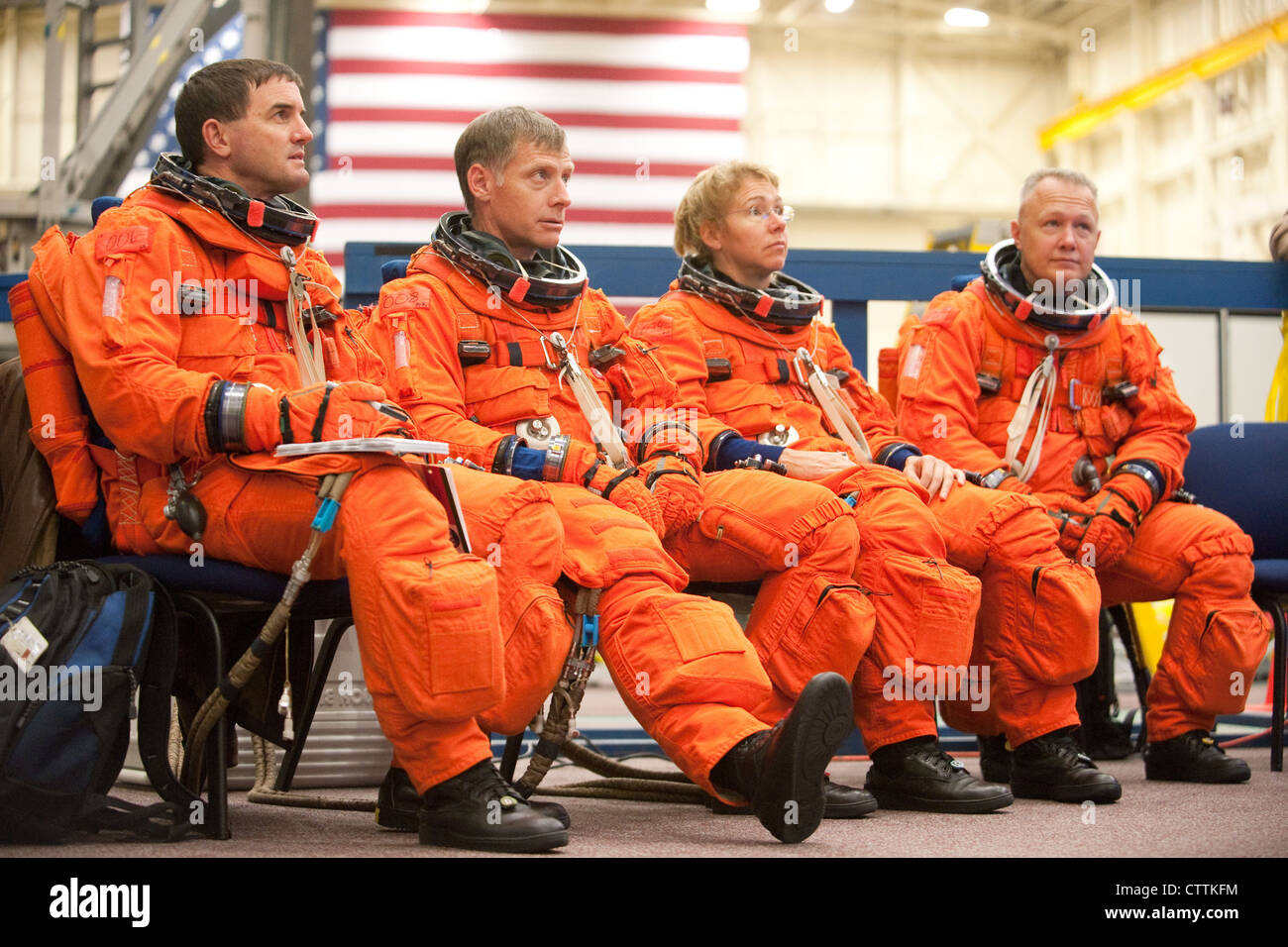 The STS-135 crew members, in their shuttle launch and entry suits ...