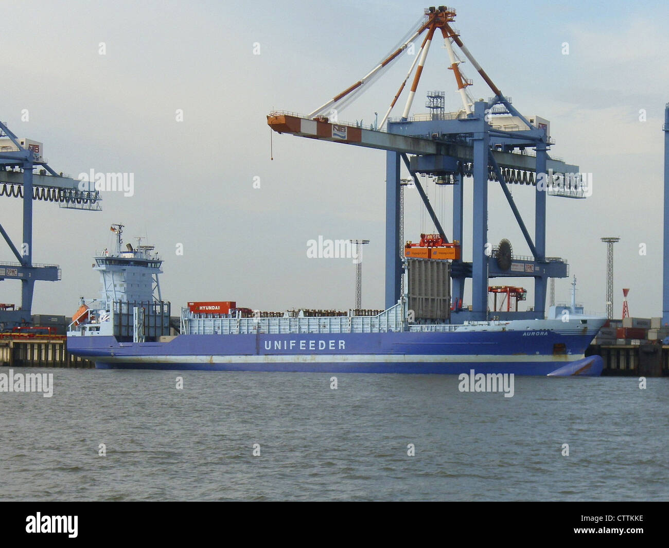 The feeder ship Aurora is docked at the container terminal in ...