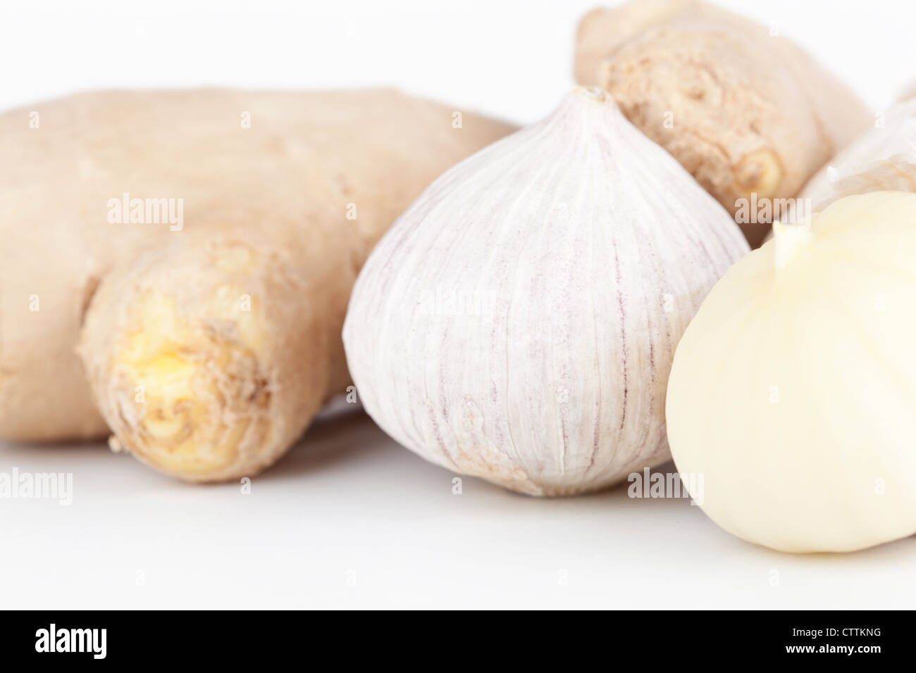 Garlic and ginger closeup on white Stock Photo - Alamy