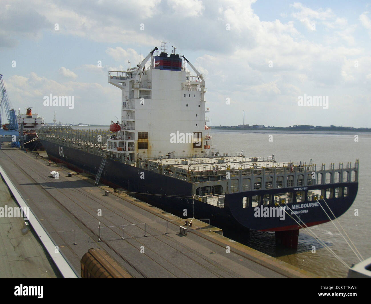 The APL Melbourne, a container ship, is docked at the port of ...