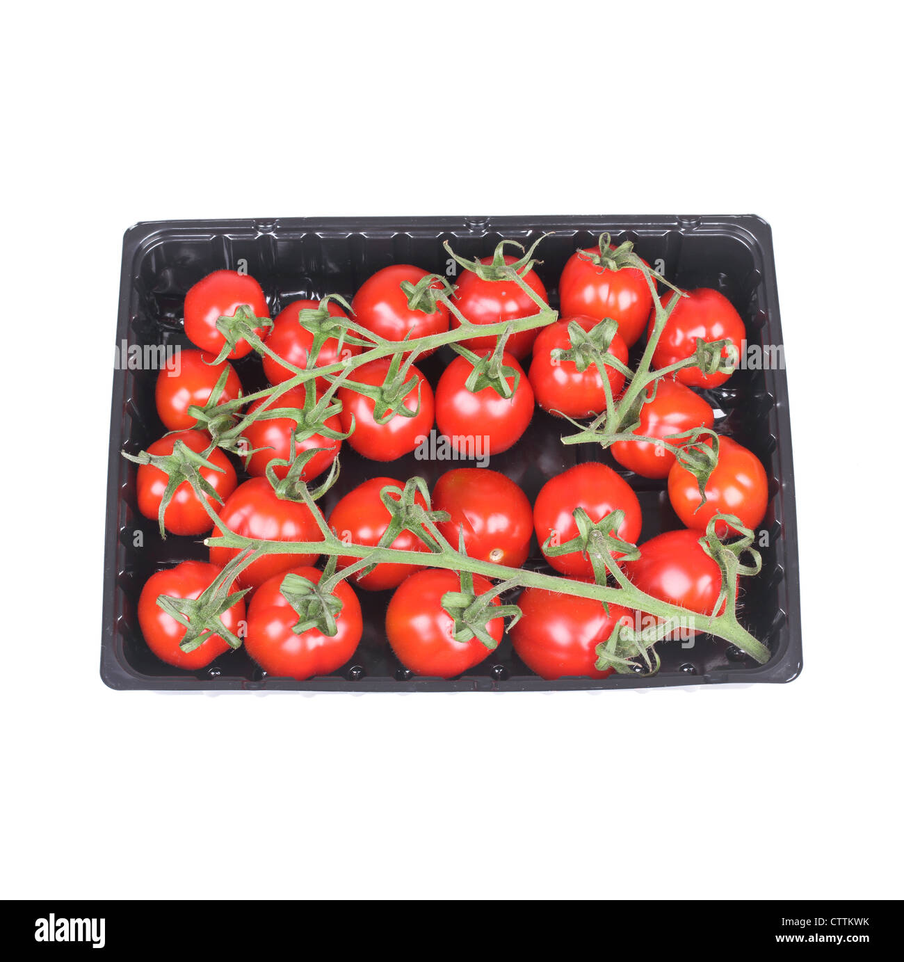 Tomato cherry in packing, closeup on white background Stock Photo - Alamy