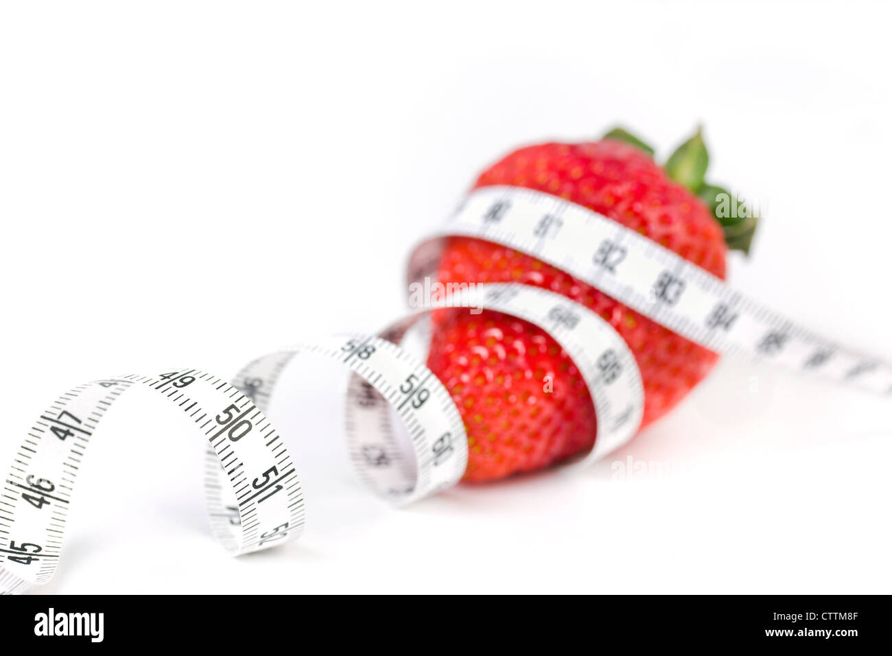 Strawberry with measure tape, closeup Stock Photo - Alamy