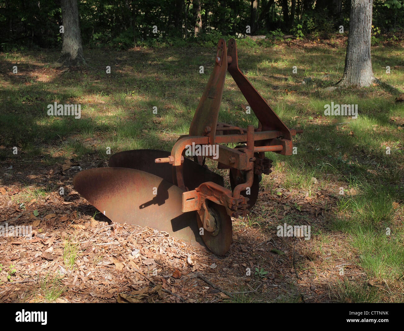 Rusty and disused plow on a farm in Morgan County, Indiana, USA, July 7 ...