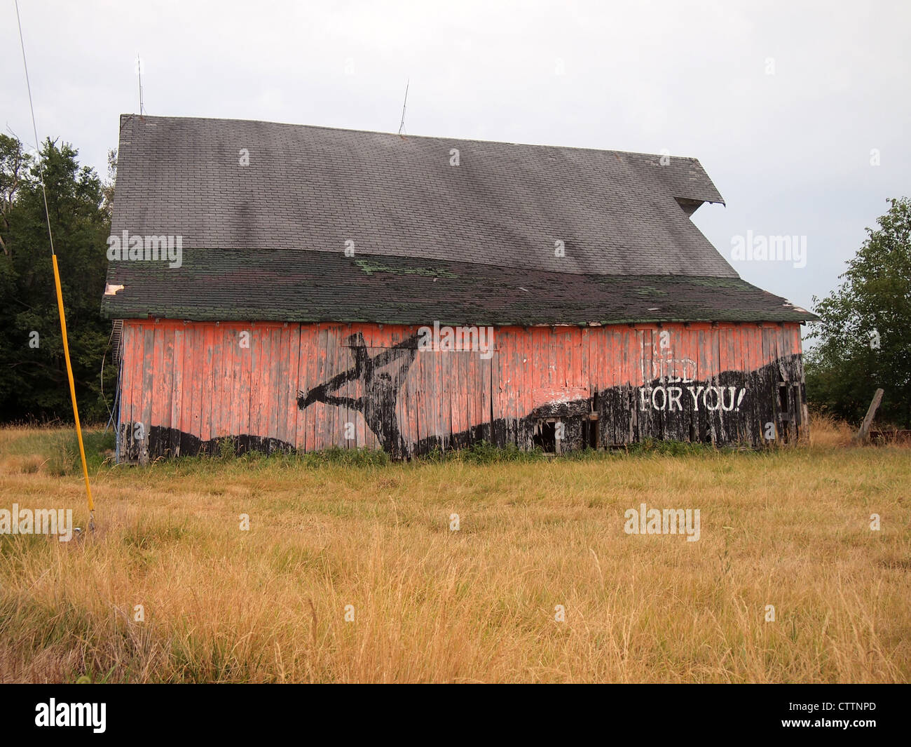 Abandoned, neglected barn painted with Christian theme in Johnson ...