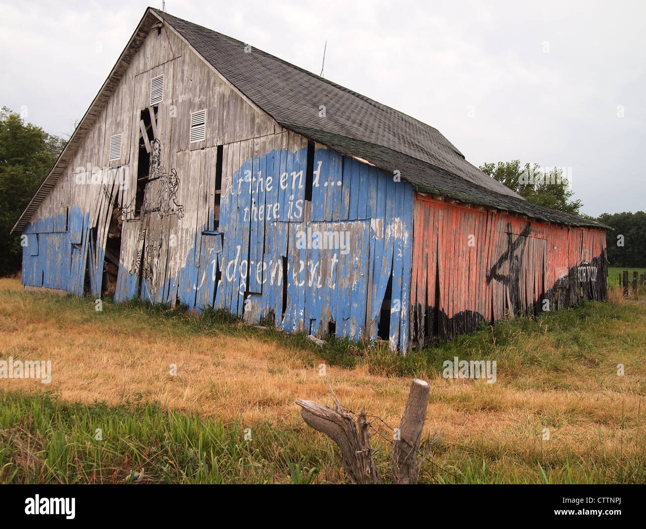 Abandoned, neglected barn painted with Christian theme in Johnson ...