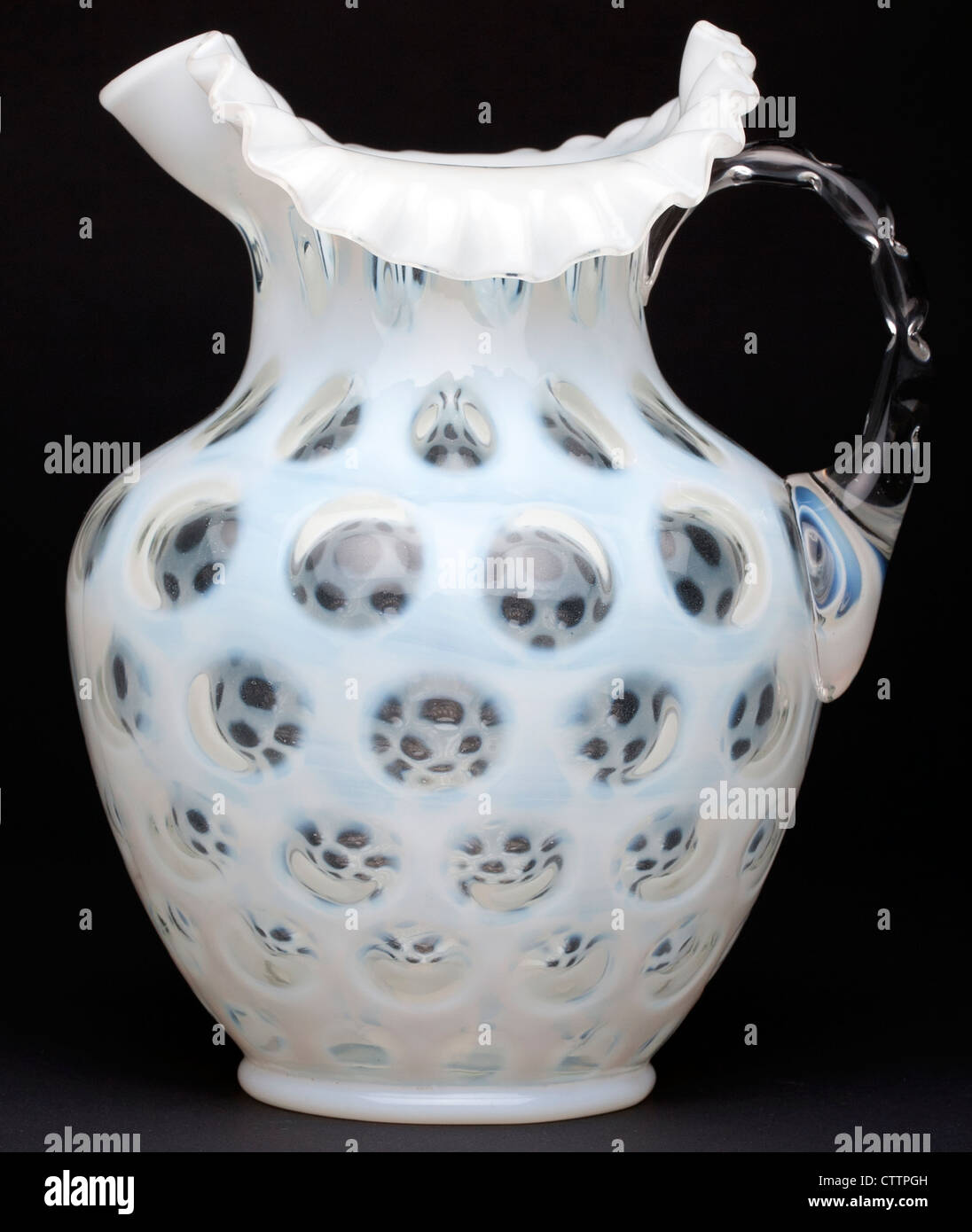 Side view of a Fenton coin dot French opalescent glass pitcher Stock ...