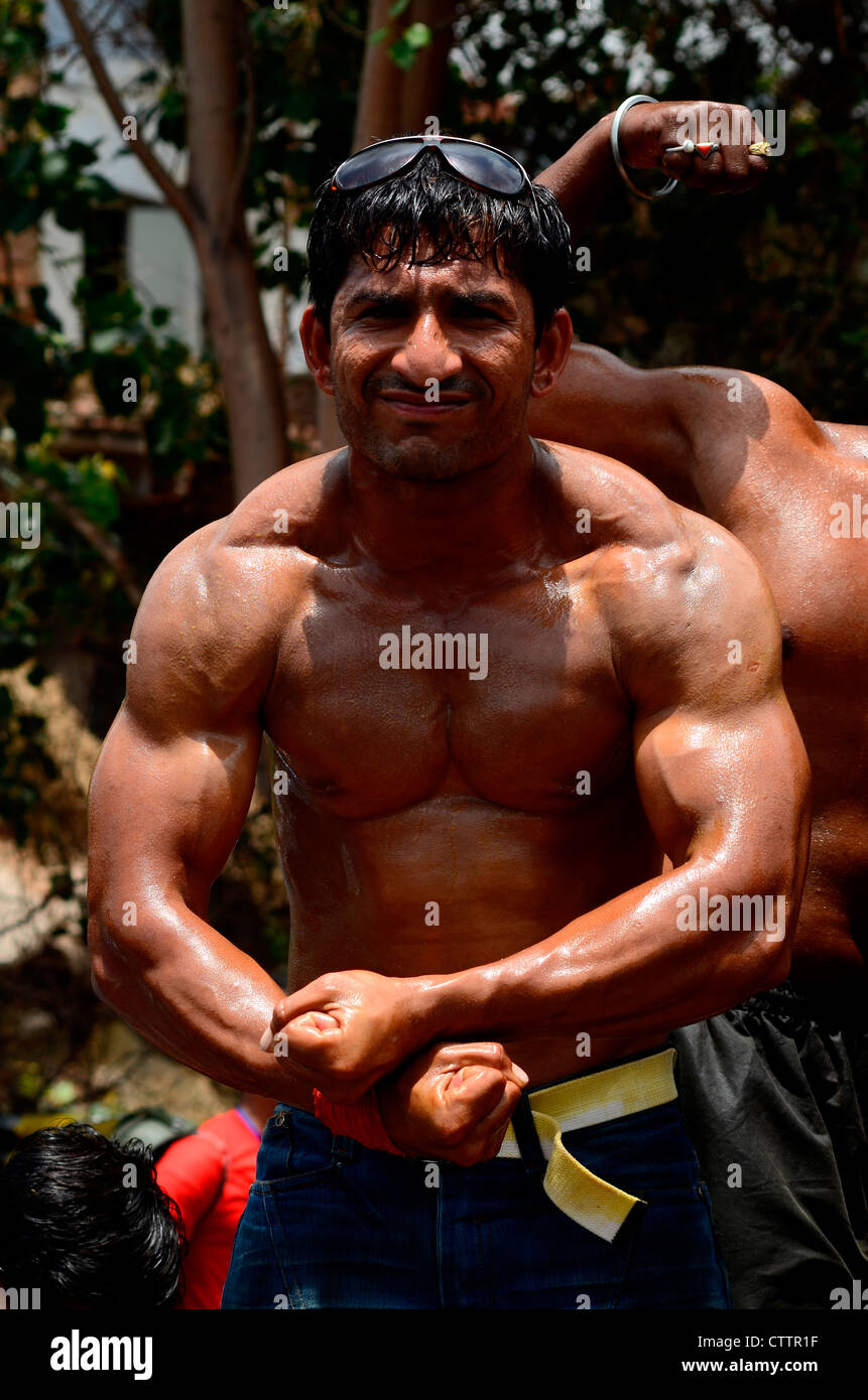 wrestlers showing body muscle Stock Photo - Alamy