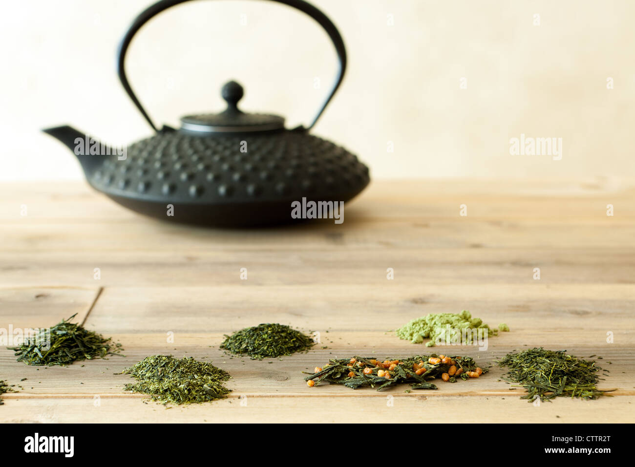 Six different Japanese teas in the form of tea leaves and ground tea ...