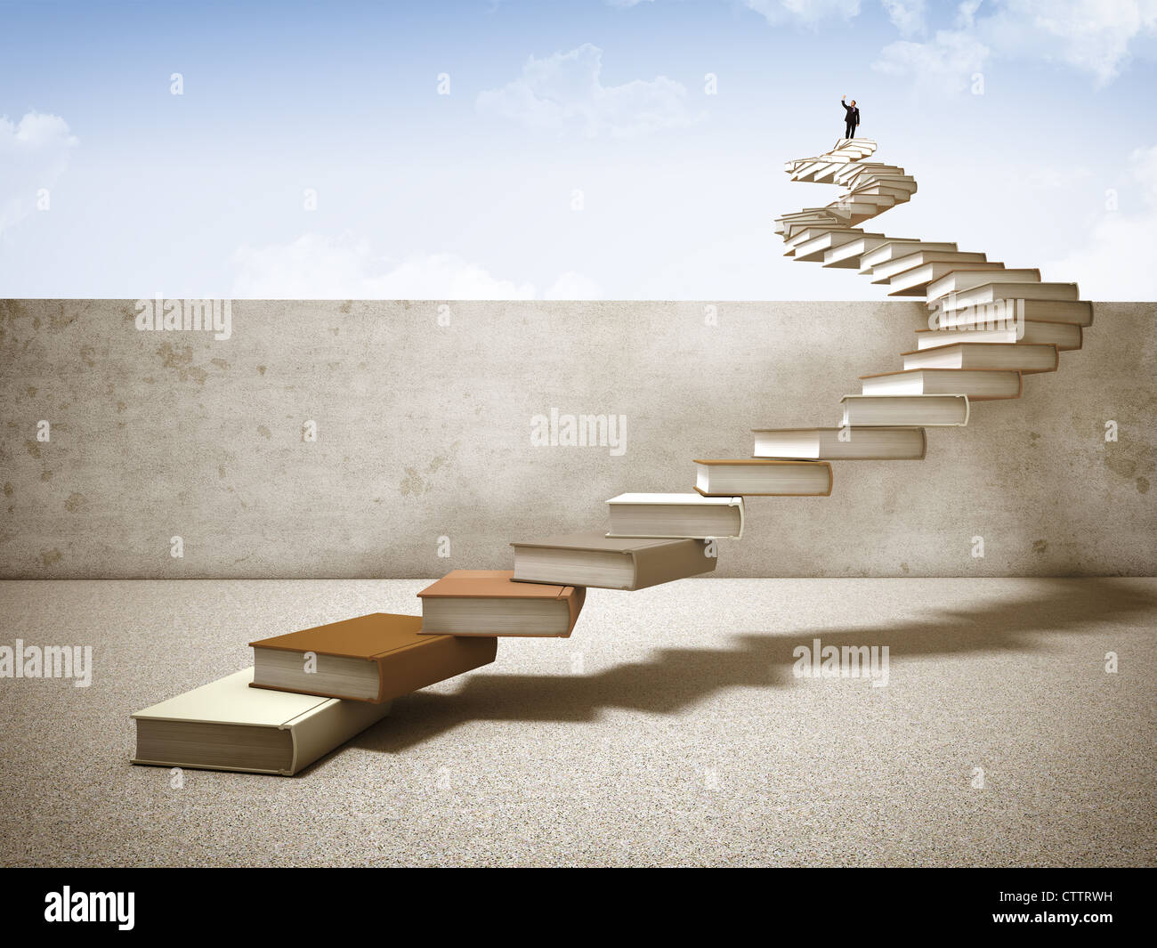 businessman on top of books stair Stock Photo - Alamy
