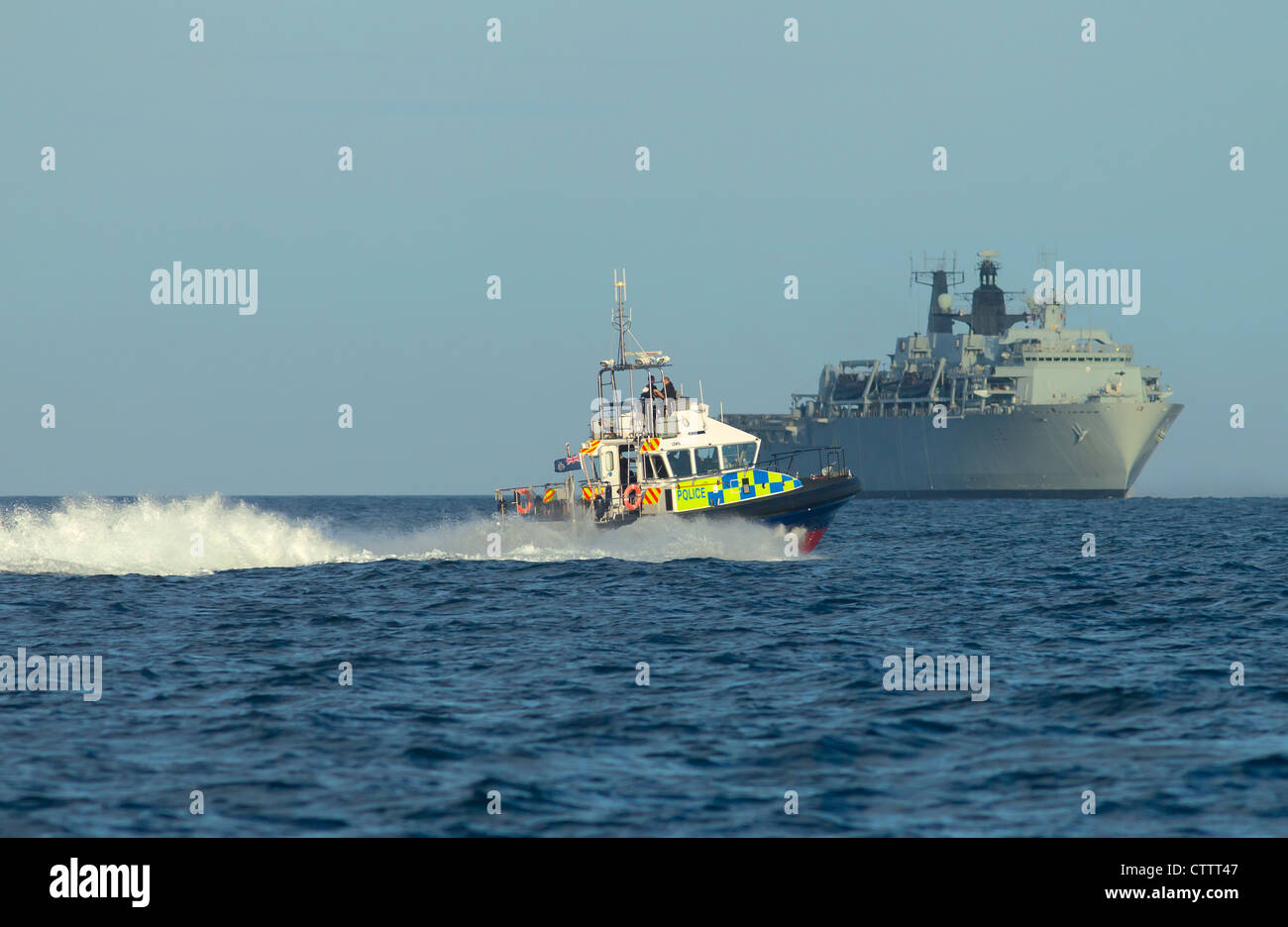Police Speed Boat passes British Warship in Weymouth Bay Dorset Stock ...