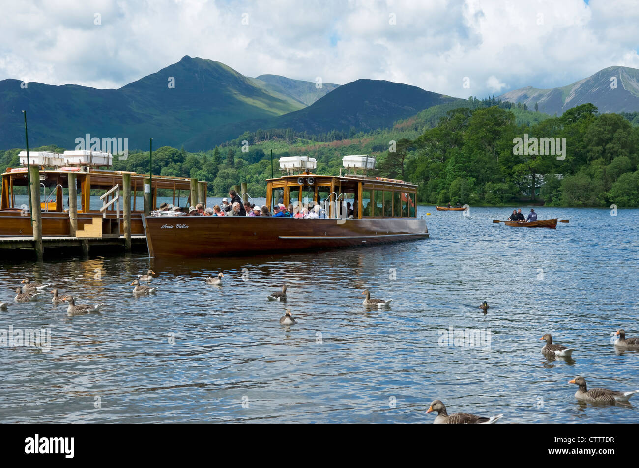 People on pleasure boat trip boats and launch on the lake in summer on ...