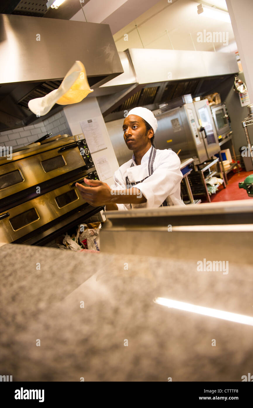 A chef preparing the pizza base dough in BARAVIN, a new pizzeria cafe ...