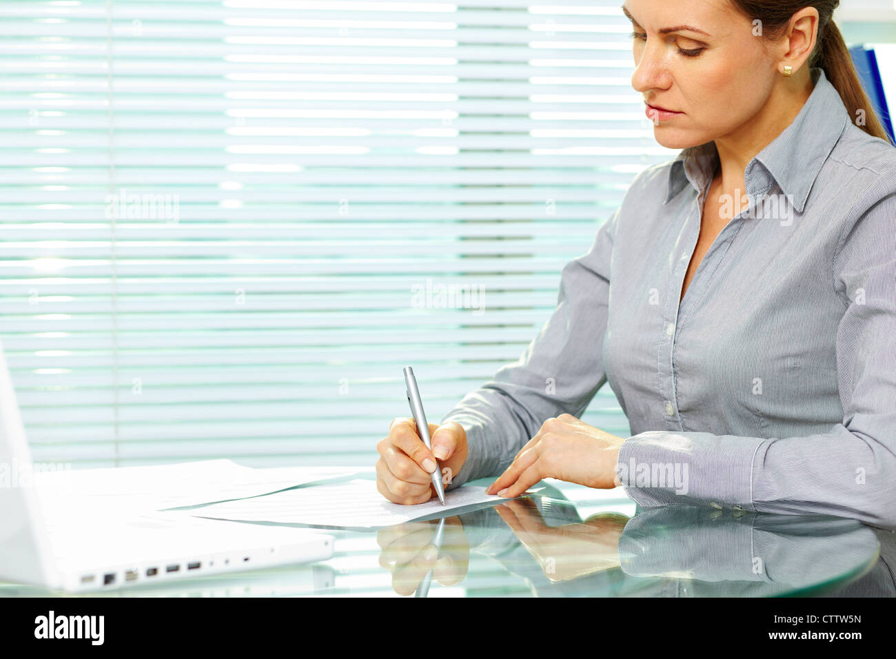Business lady putting signatures on documents Stock Photo - Alamy
