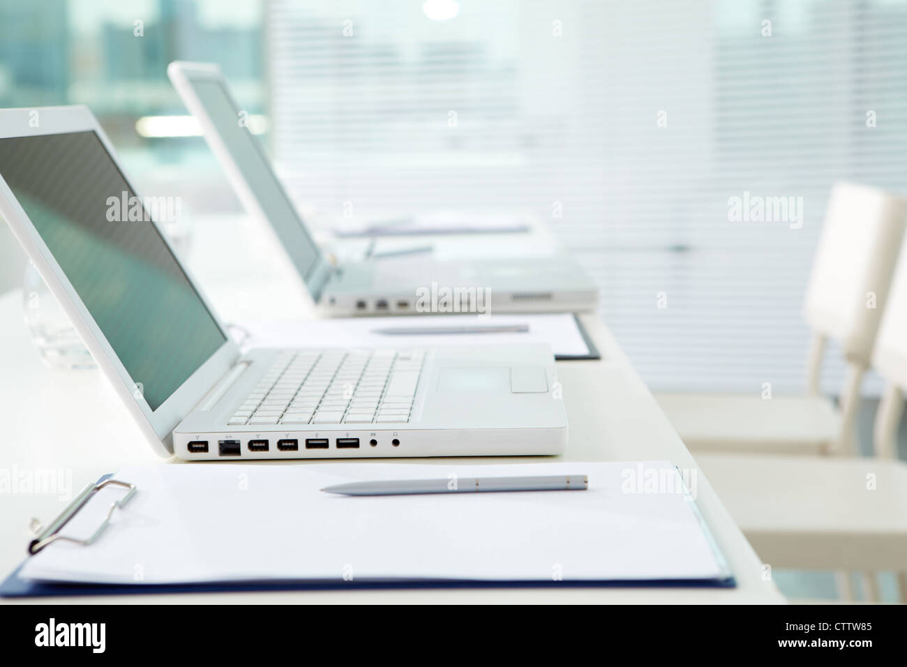 Image of laptops on table Stock Photo - Alamy