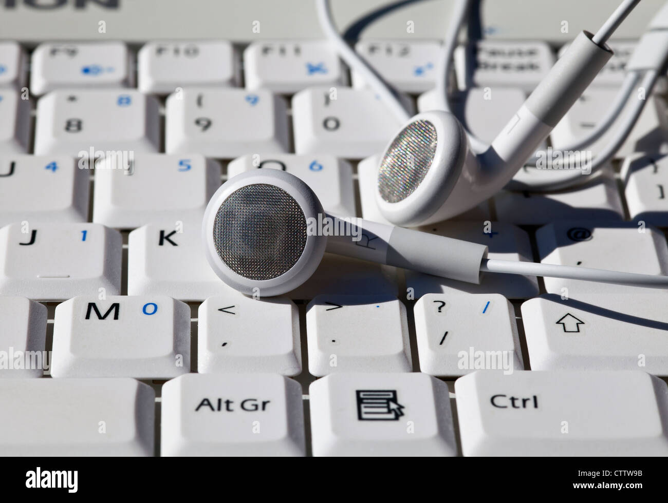 Laptop with ear phones Stock Photo - Alamy