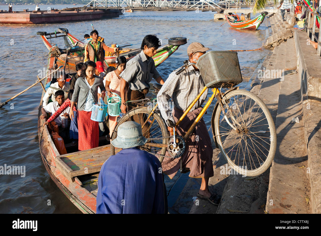 Ferry boats unloading at jetty on Yangon River, Myanmar Stock Photo - Alamy