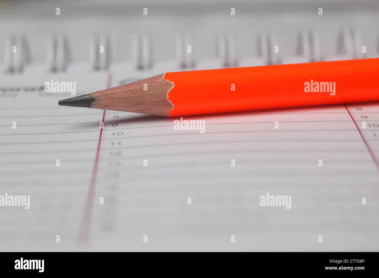 Pencil laying on spiral notebook Stock Photo - Alamy