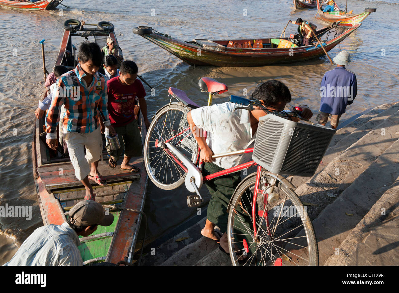 Ferry boats unloading at jetty on Yangon River, Yangon, Myanmar Stock ...