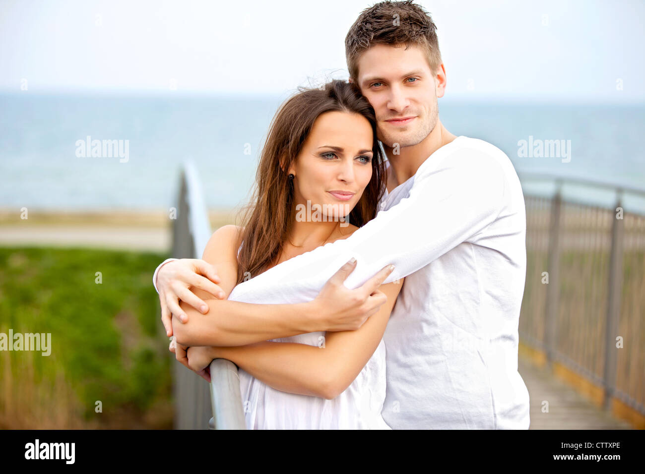Portrait of a young romantic couple embracing each other Stock Photo ...