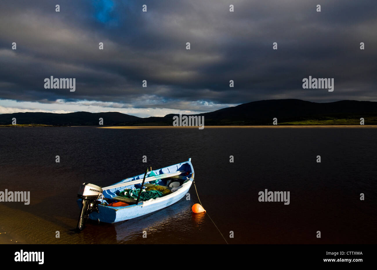 Dramatic evening light on fishing boat Stock Photo - Alamy