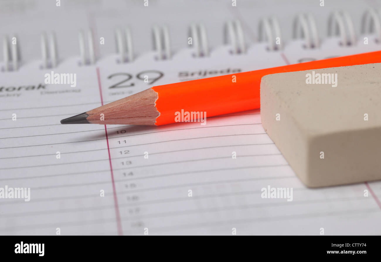 Pencil and eraser laying on spiral notebook or notepad Stock Photo - Alamy