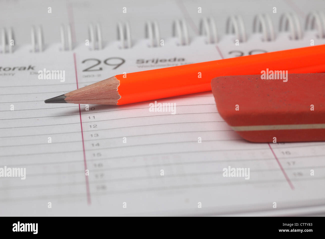 Pencil and eraser laying on spiral notebook or notepad Stock Photo - Alamy