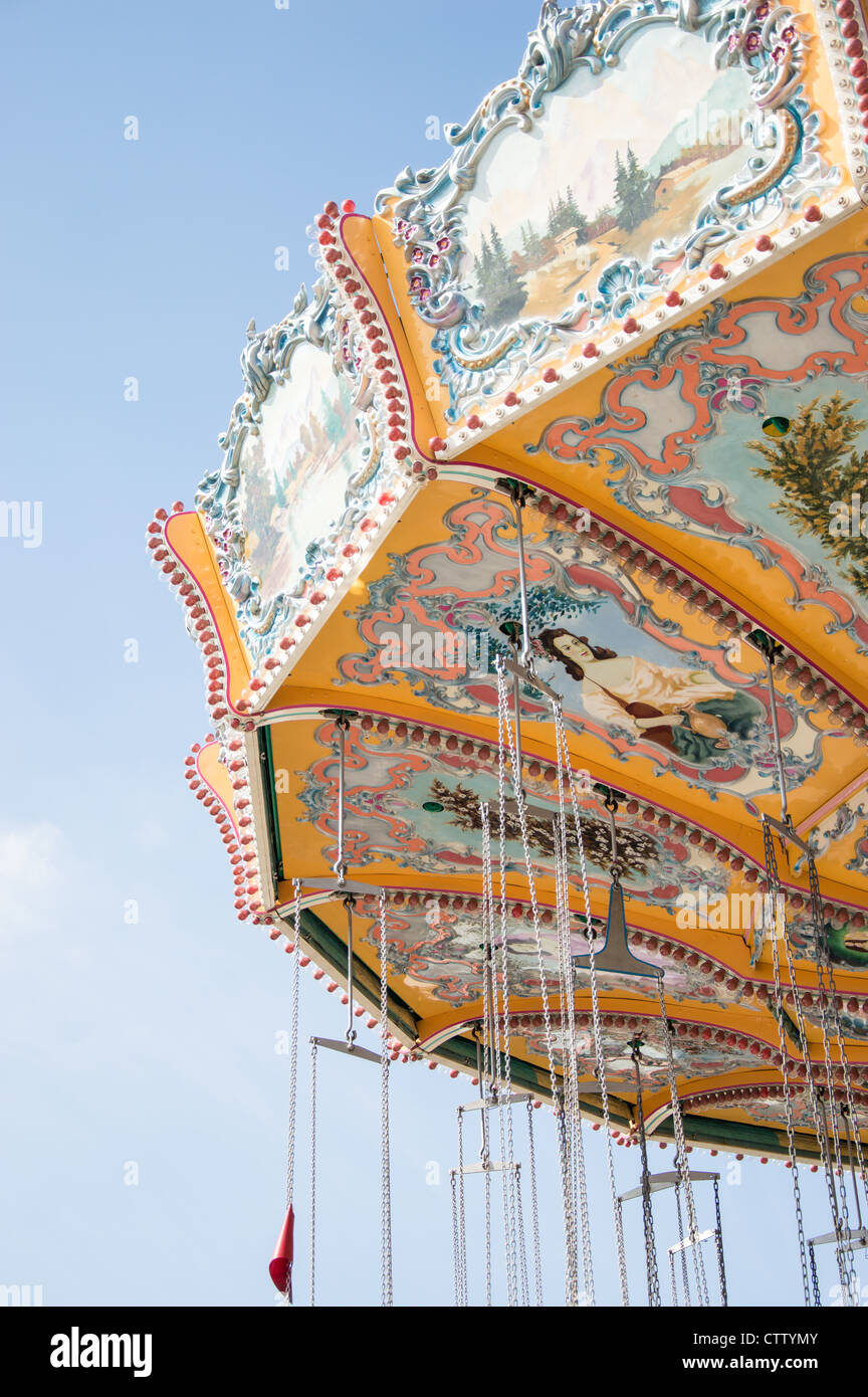 Chairoplane against blue sky Stock Photo - Alamy