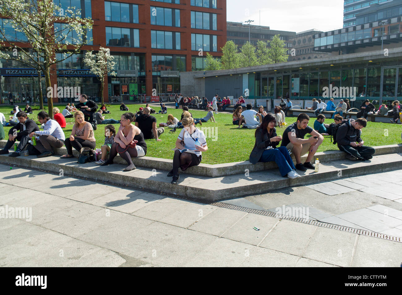 People Enjoying the Spring Sunshine Stock Photo - Alamy
