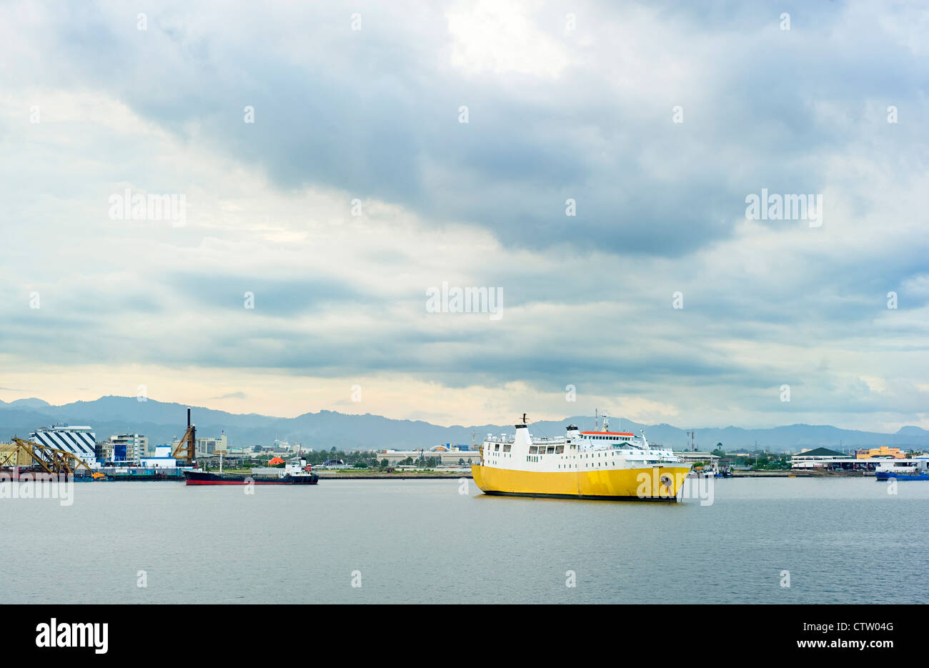 Yellow ship in industrial harbor. Cebu, Philippines Stock Photo - Alamy
