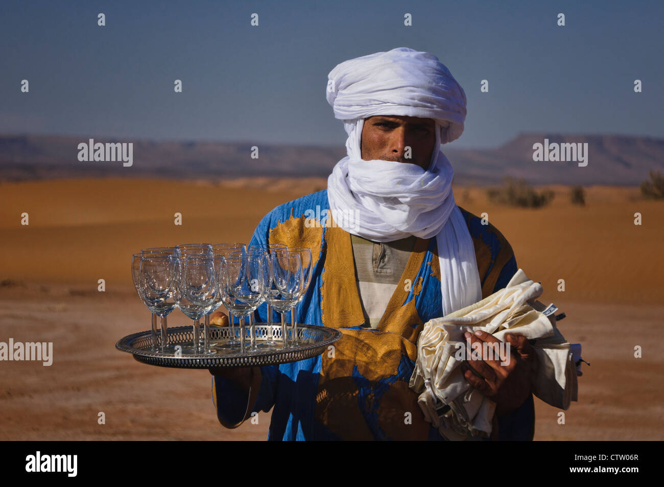 Berber serving wine at a luxury camp in the Sahara Desert at Erg ...